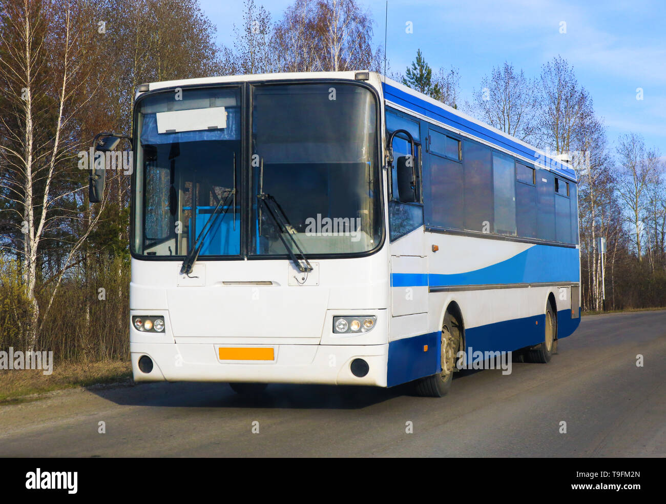 white bus goes on the country highway Stock Photo - Alamy