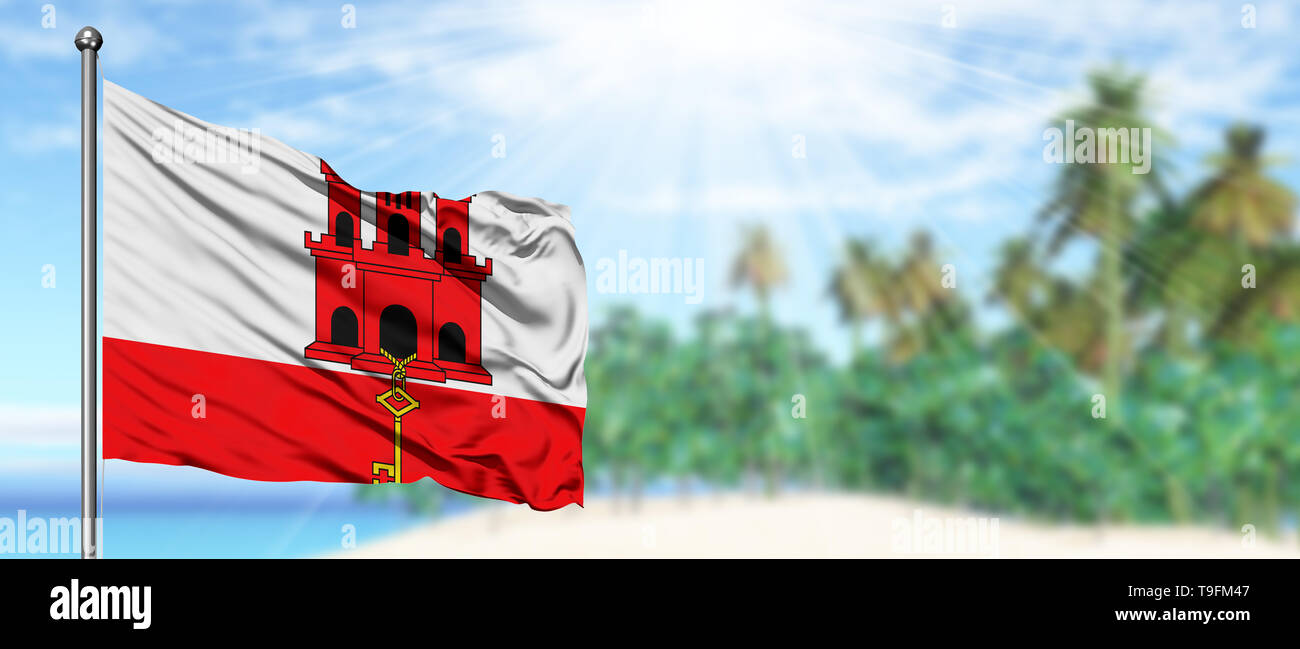 Waving Gibraltar flag in the sunny blue sky with summer beach ...