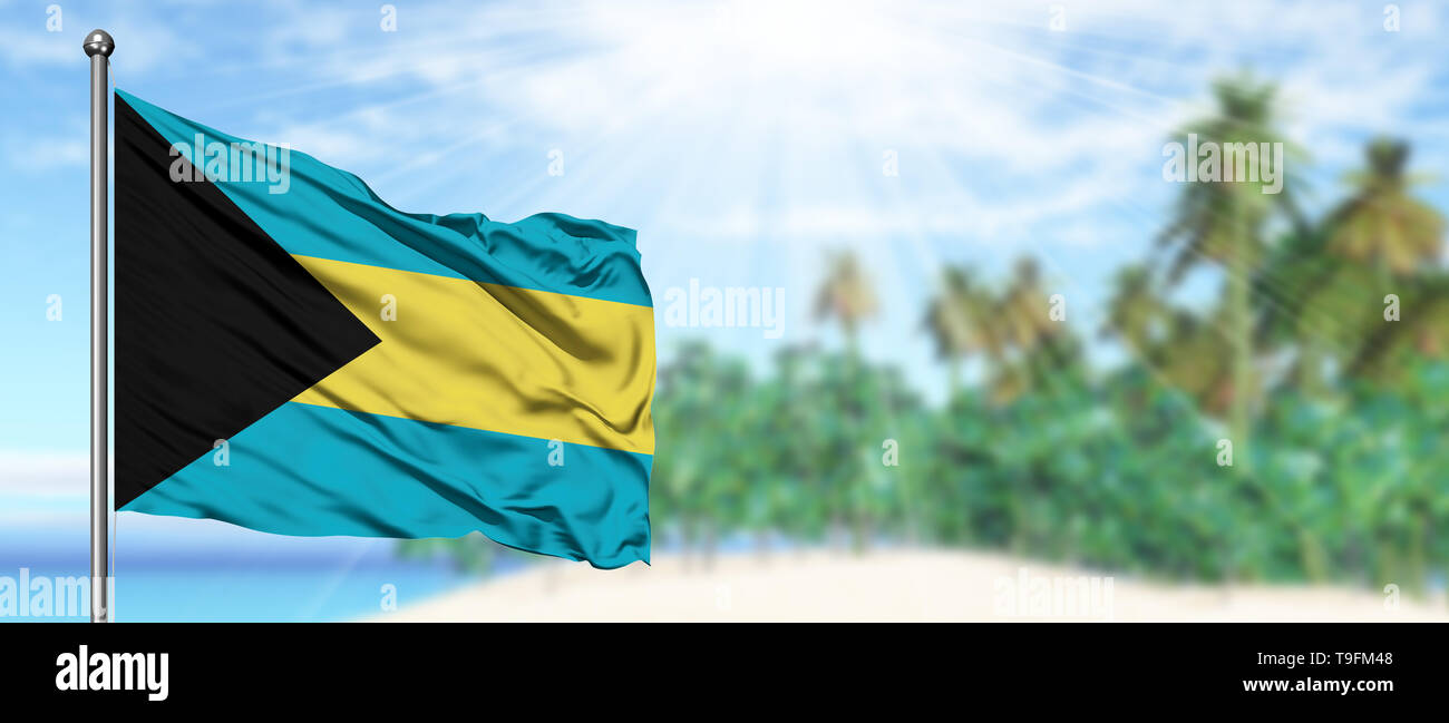 Waving Bahamas flag in the sunny blue sky with summer beach background ...