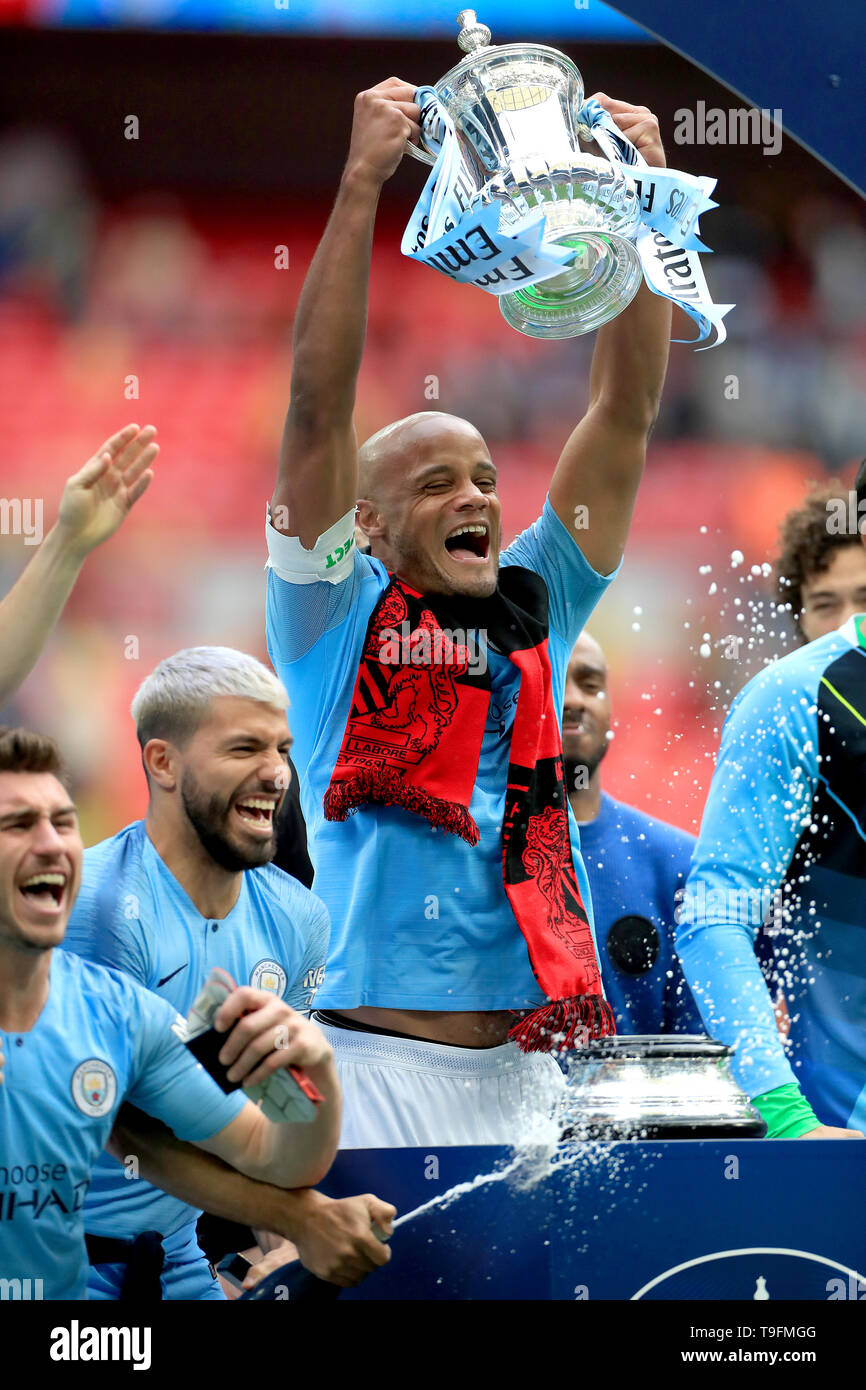 Manchester City's Vincent Kompany celebrates with the trophy after ...