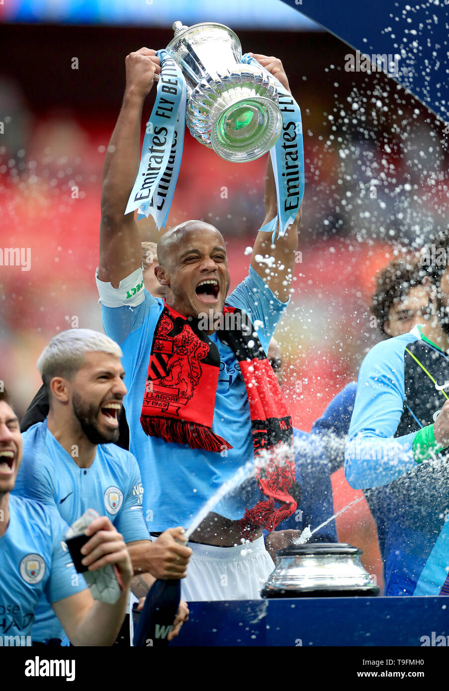 Manchester City's Vincent Kompany celebrates with the trophy after ...