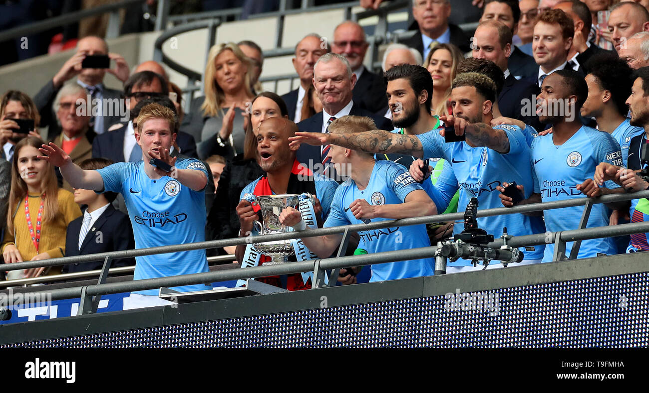 Manchester City's Vincent Kompany (second left) celebrates with the ...
