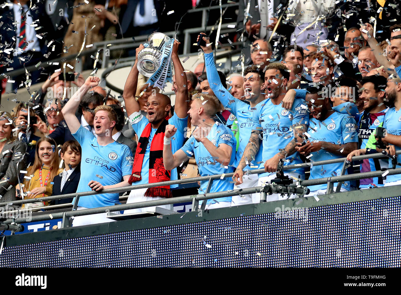 Manchester City's Vincent Kompany (second left) celebrates with the ...