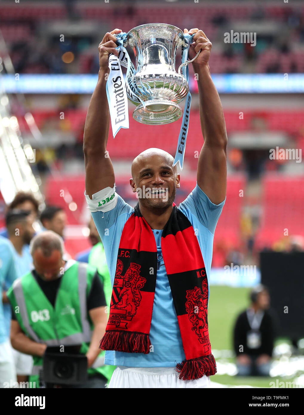 Manchester City's Vincent Kompany celebrates with the trophy after ...