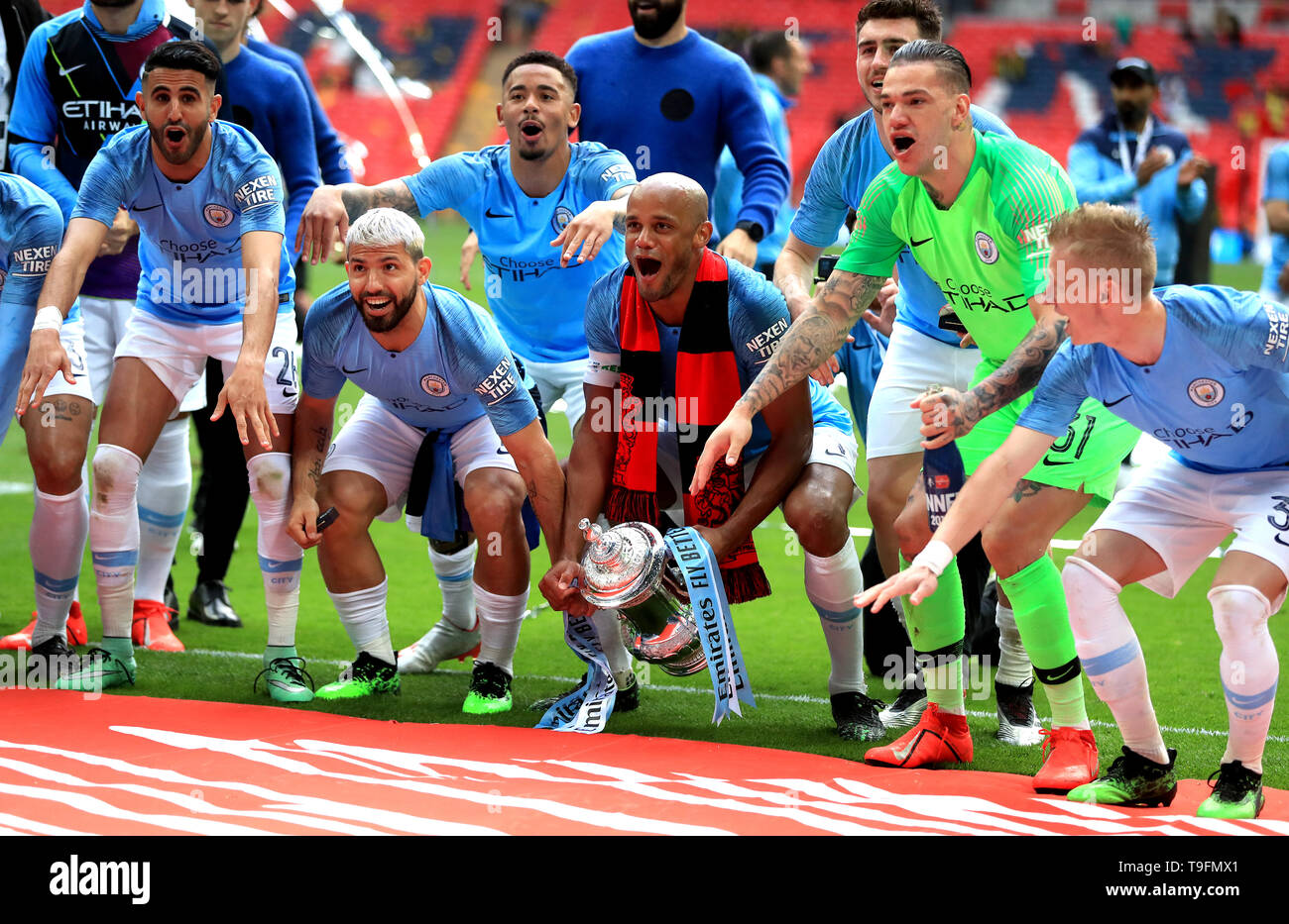Manchester City's Vincent Kompany celebrates with the trophy after ...