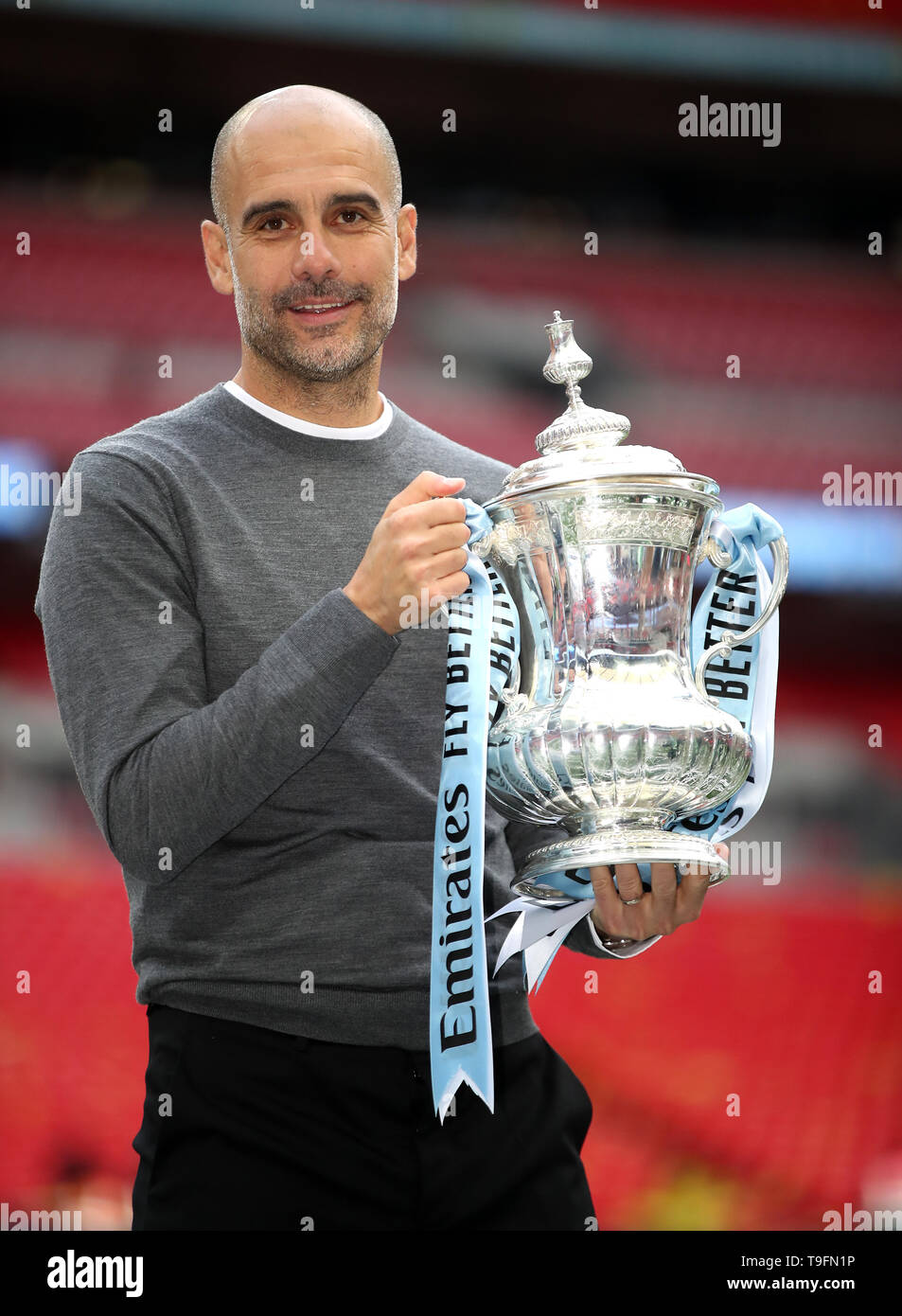 Manchester City manager Pep Guardiola celebrates with the trophy after ...