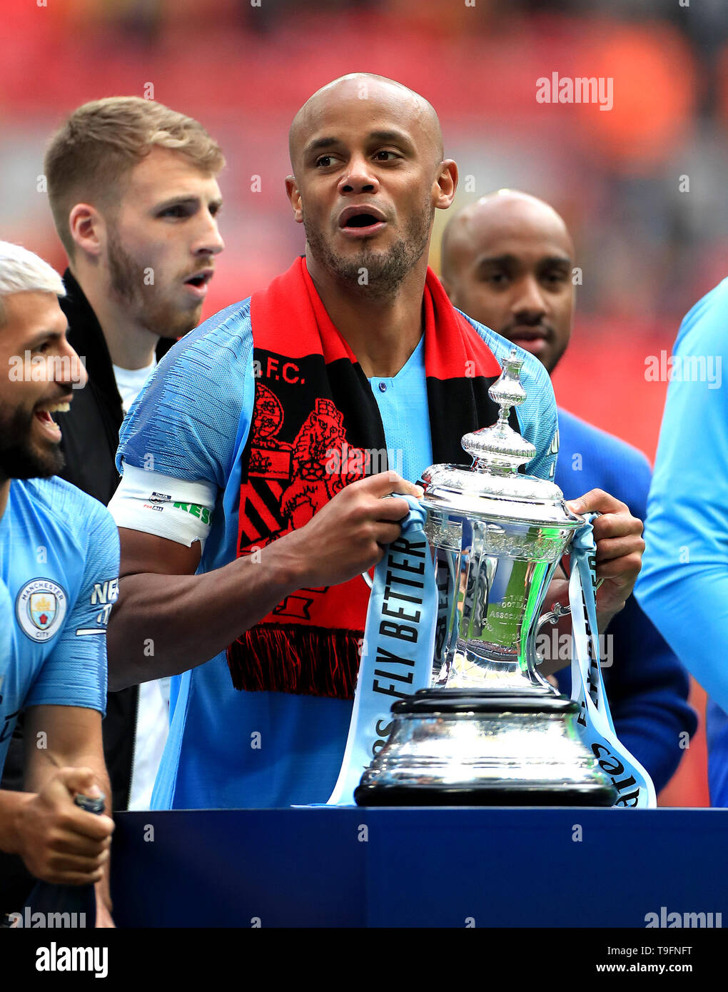 Manchester City's Vincent Kompany celebrates with the trophy after ...