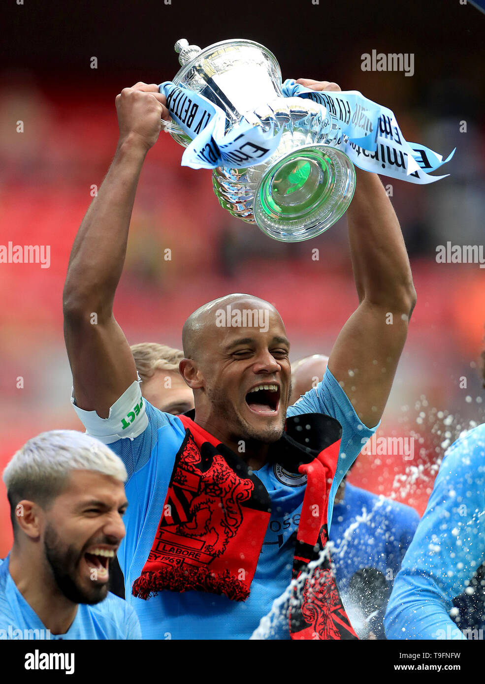Manchester City's Vincent Kompany celebrates with the trophy after ...