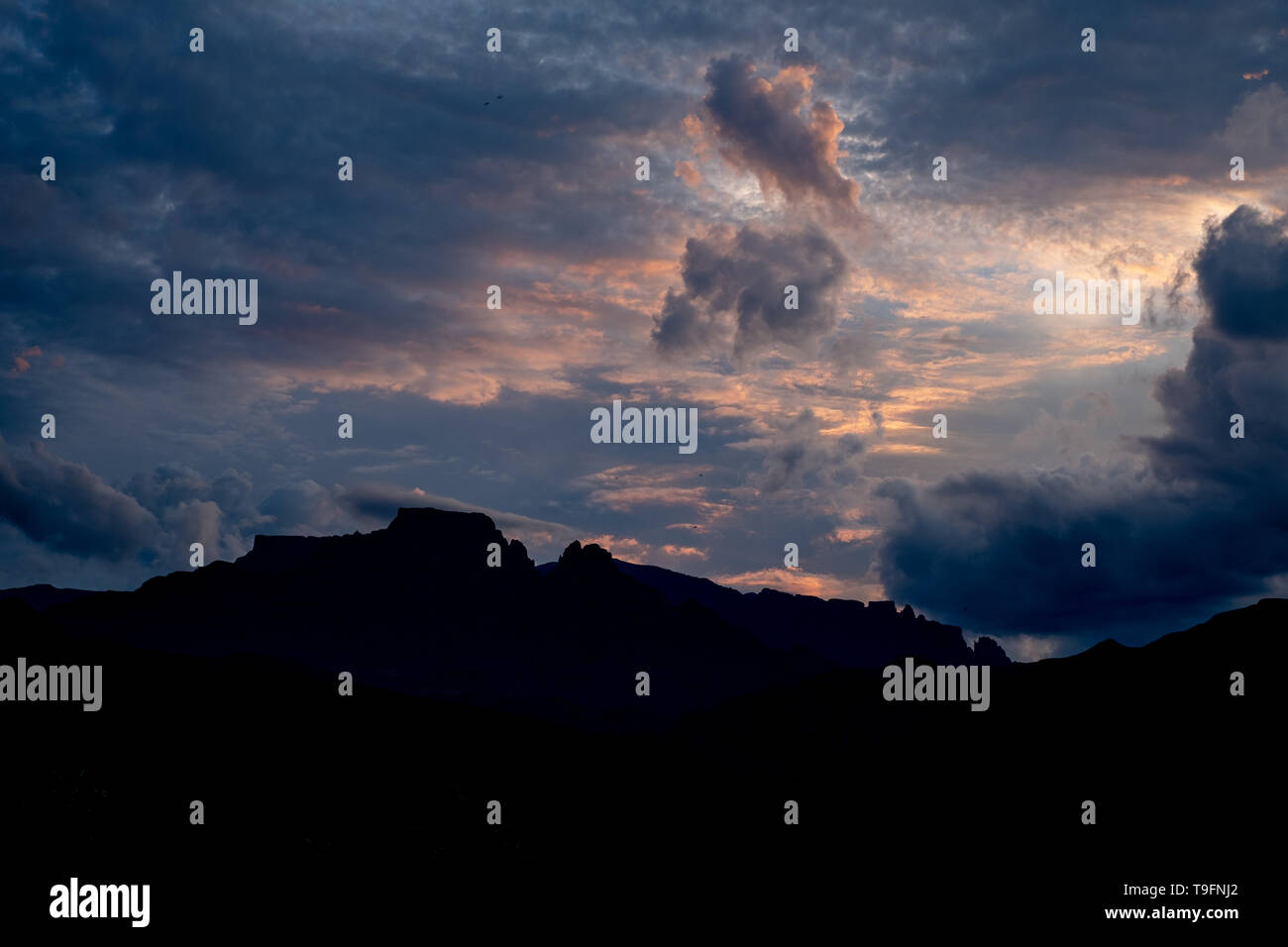 Champagne Castle, Cathkin Peak and Monk's Cowl: silhouetted peaks near ...