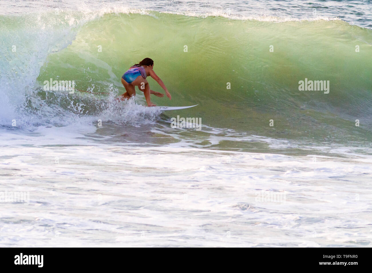 Girl surfing wave hi-res stock photography and images - Alamy