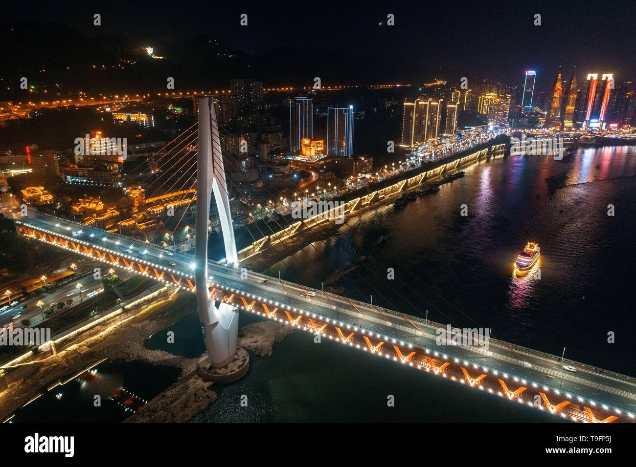 Aerial view of Bridge and city urban architecture at night in Chongqing ...
