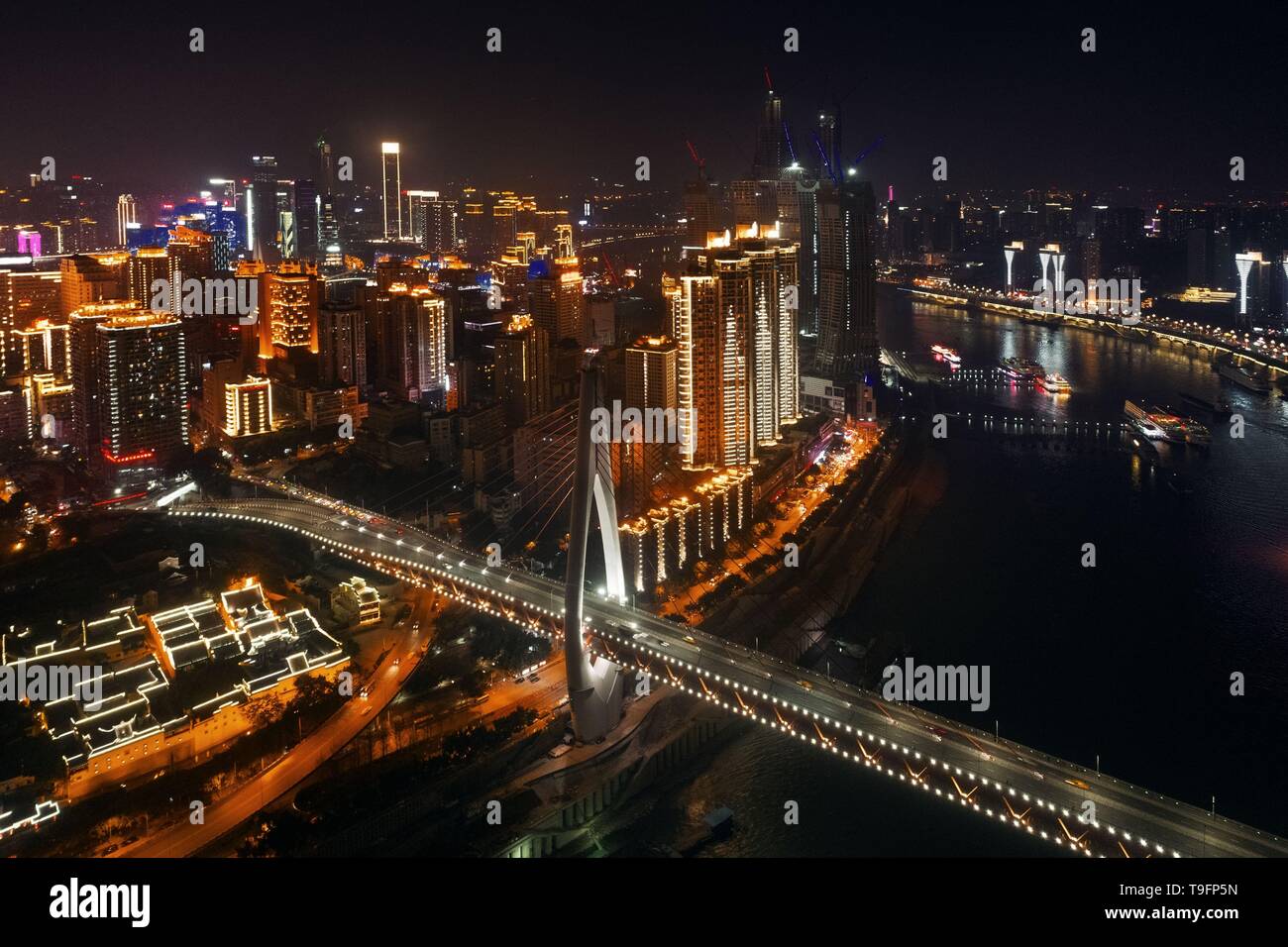 Aerial view of Bridge and city urban architecture at night in Chongqing ...