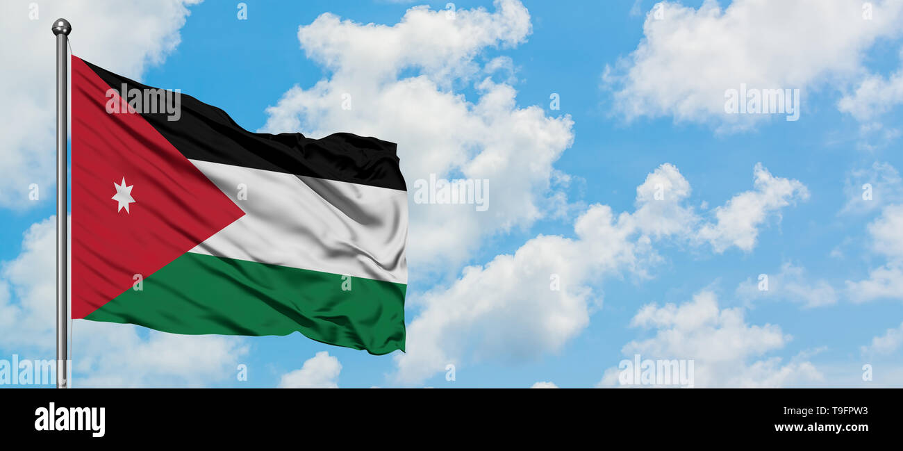 Jordan flag waving in the wind against white cloudy blue sky. Diplomacy ...