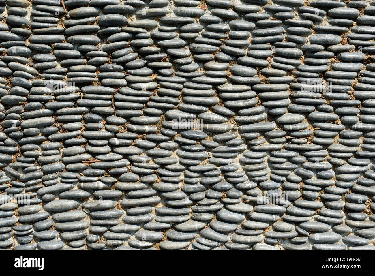 Pattern of round pebble stone. Background of the river rock pebbles ...