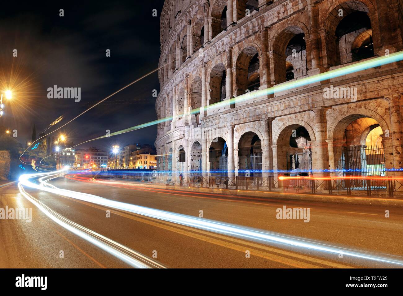 Colosseum at night with light trail in Rome, Italy Stock Photo - Alamy