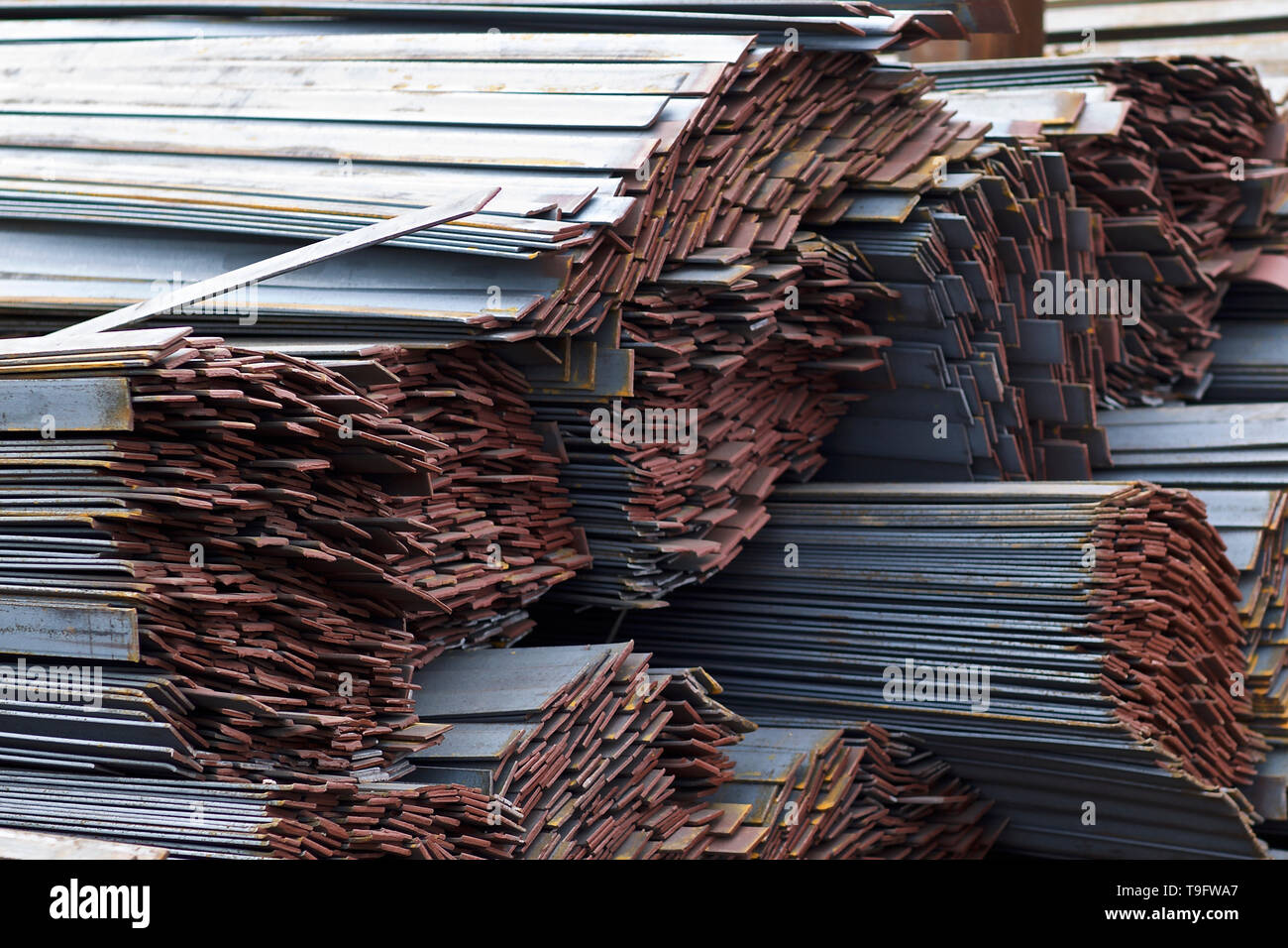 Metal profile strip in packs at the warehouse of metal products, Russia ...