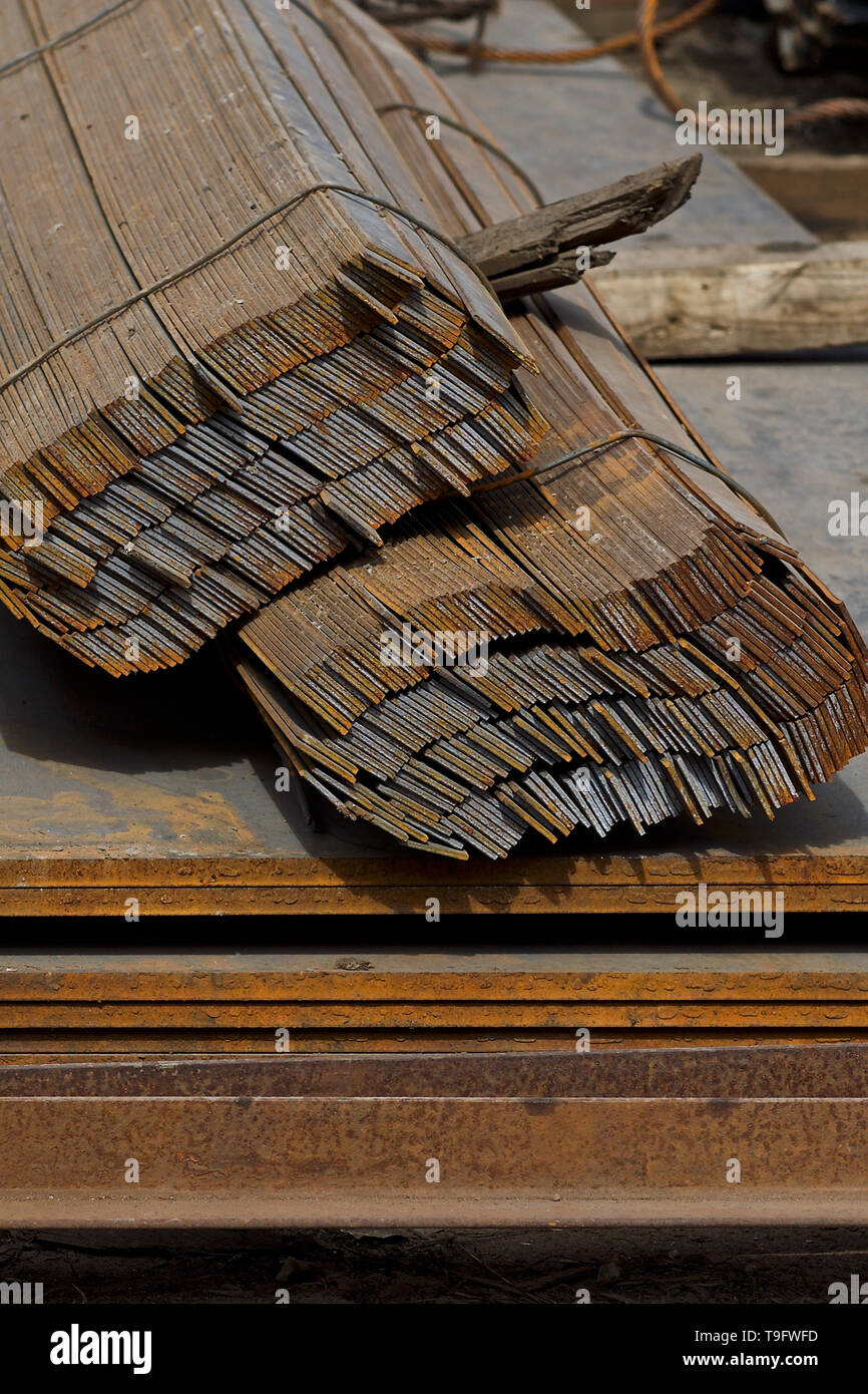Metal profile strip in packs at the warehouse of metal products, Russia ...