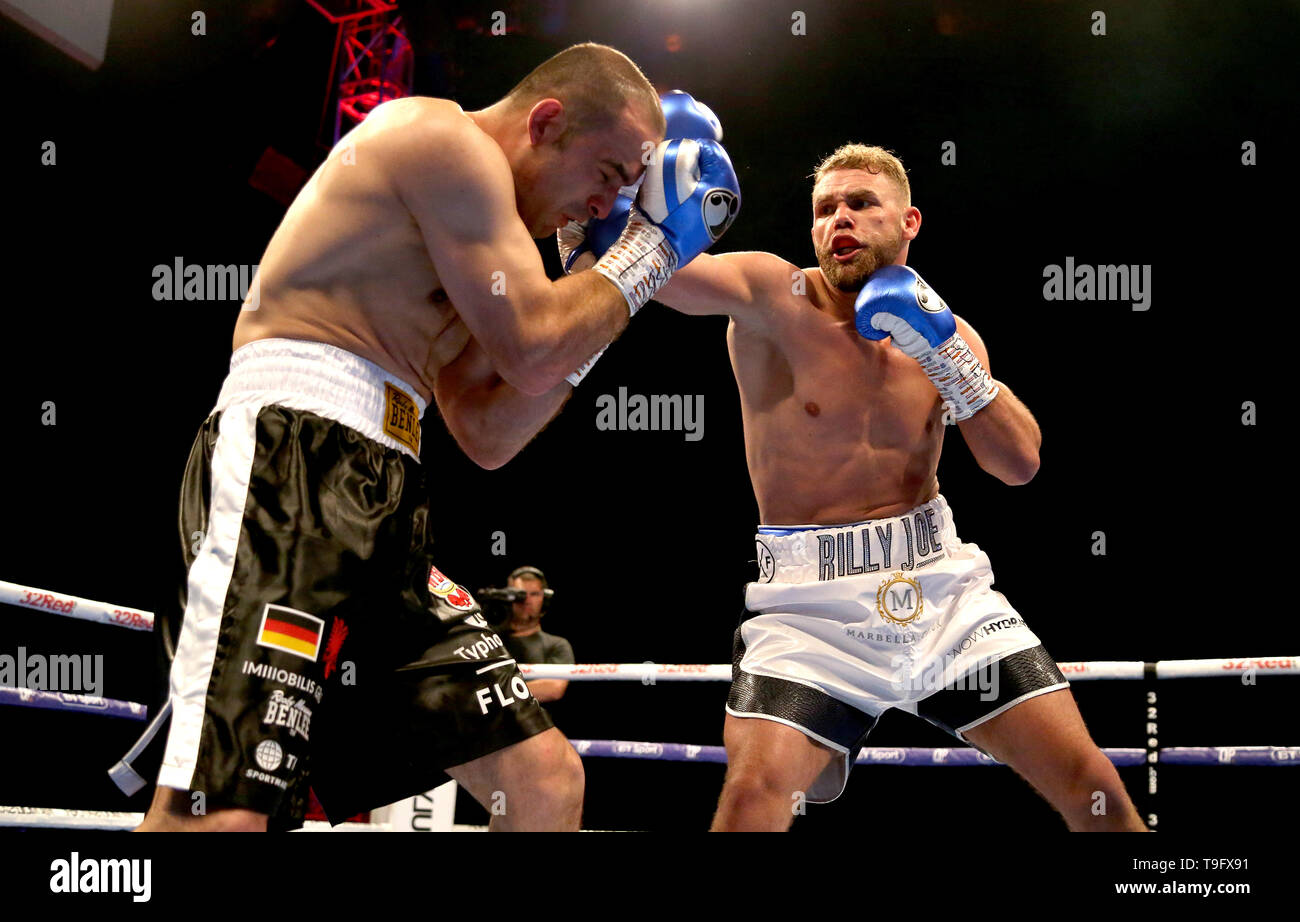 Billy Joe Saunders (right) in action against Shefat Isufi in the WBO ...
