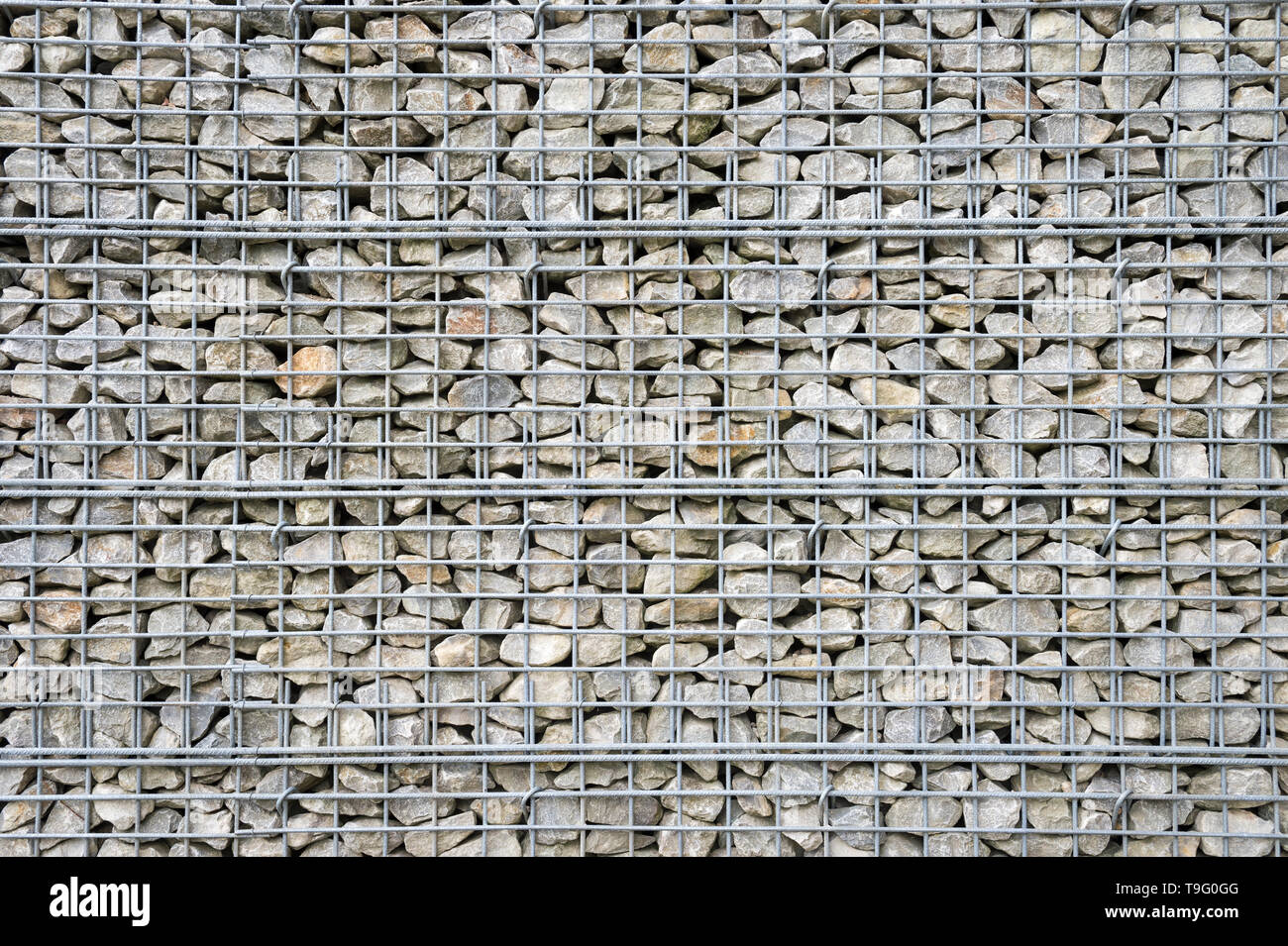 Abstract architectural background of rough retaining wall made from ...