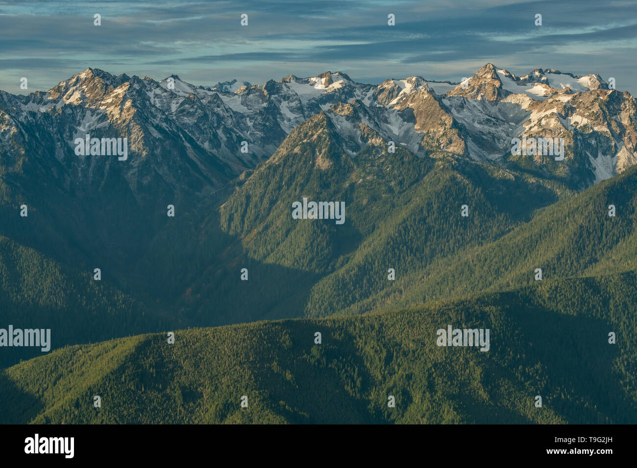 Snow covered mountain with green valley hi-res stock photography and ...