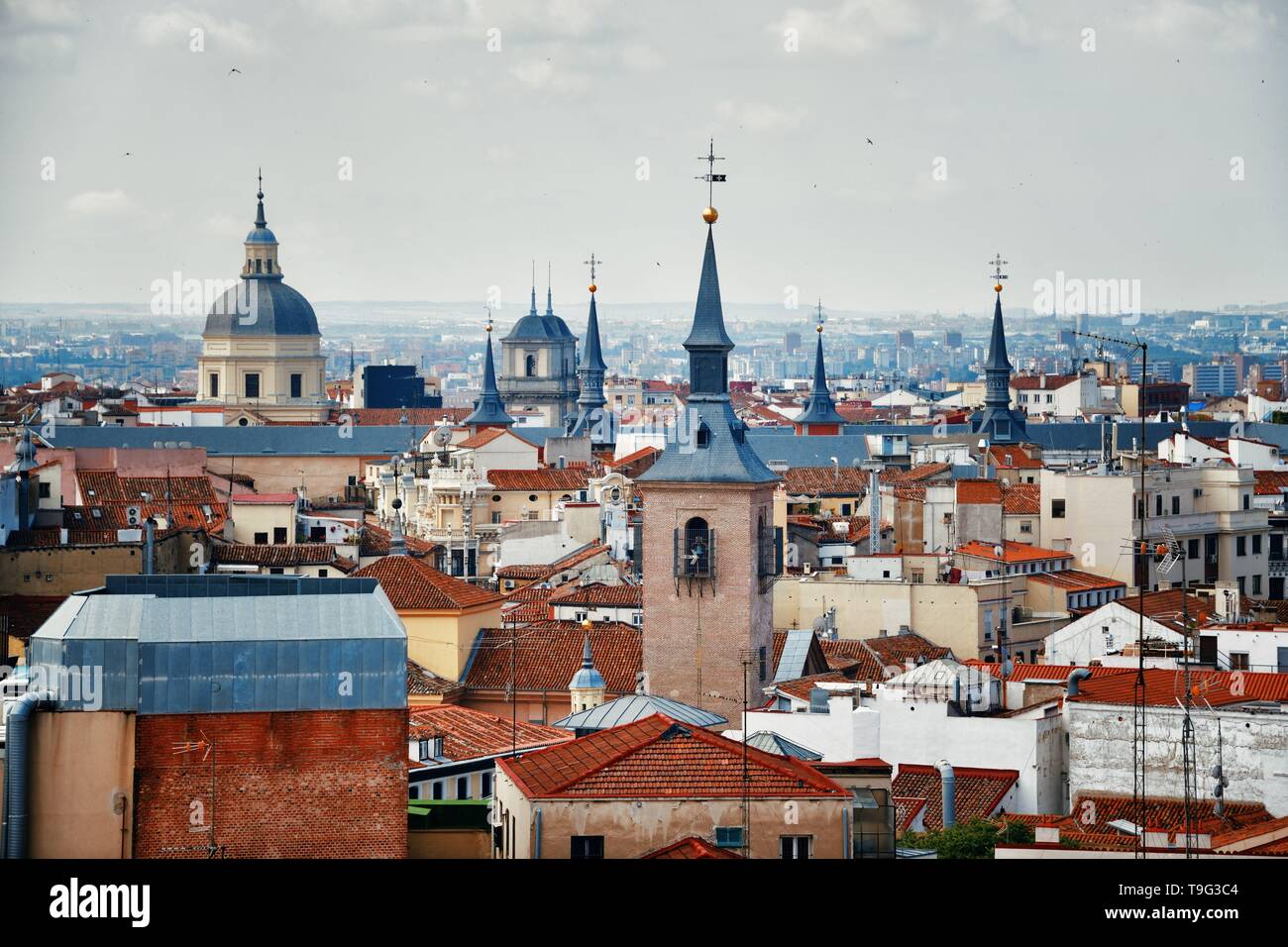 Madrid skyline rooftop view with buildings and church bell tower in ...