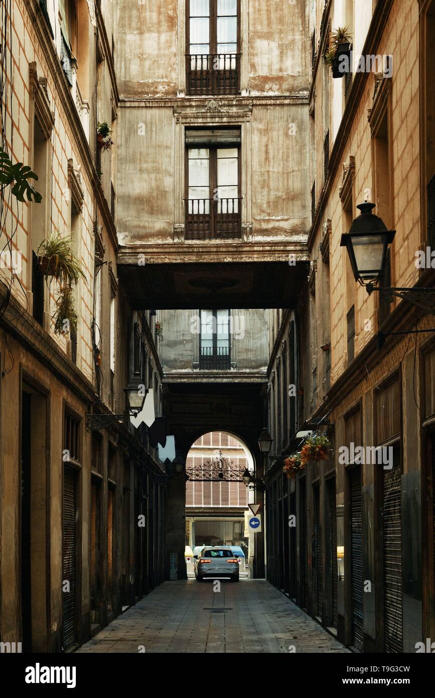 Street view of small alley with historic buildings in Madrid, Spain ...