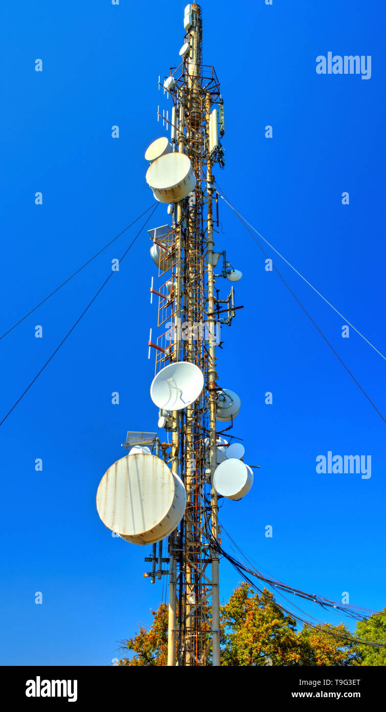 Communication antenna tower on blue sky Stock Photo - Alamy