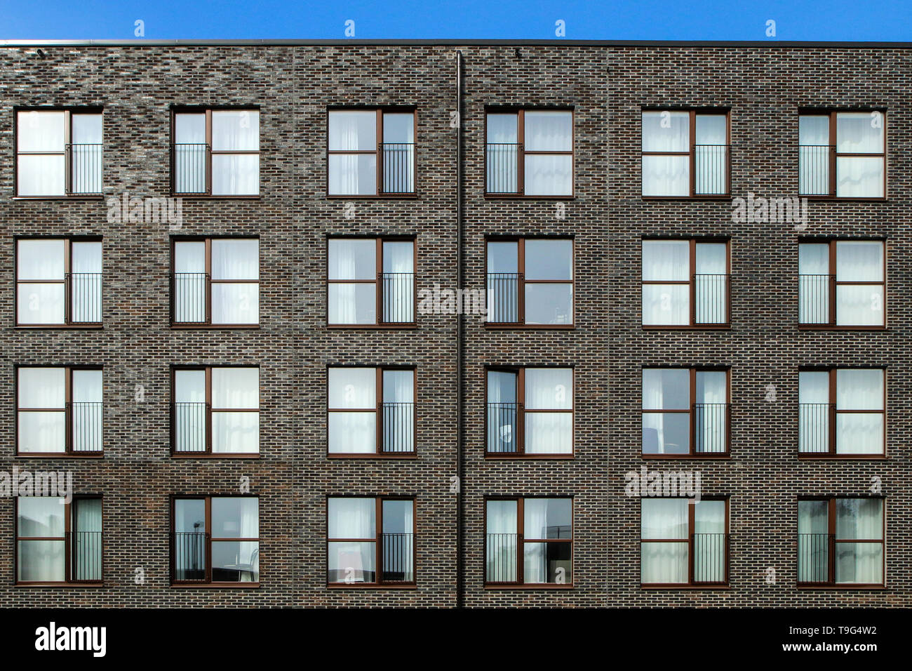 The detail of a facade of a modern living building made of bricks with ...