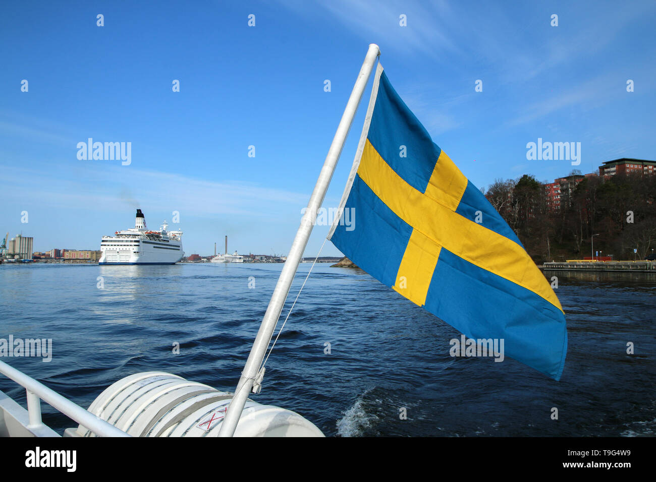 The detail swedish flag hanging on the ferry in Stockholm with a big ...