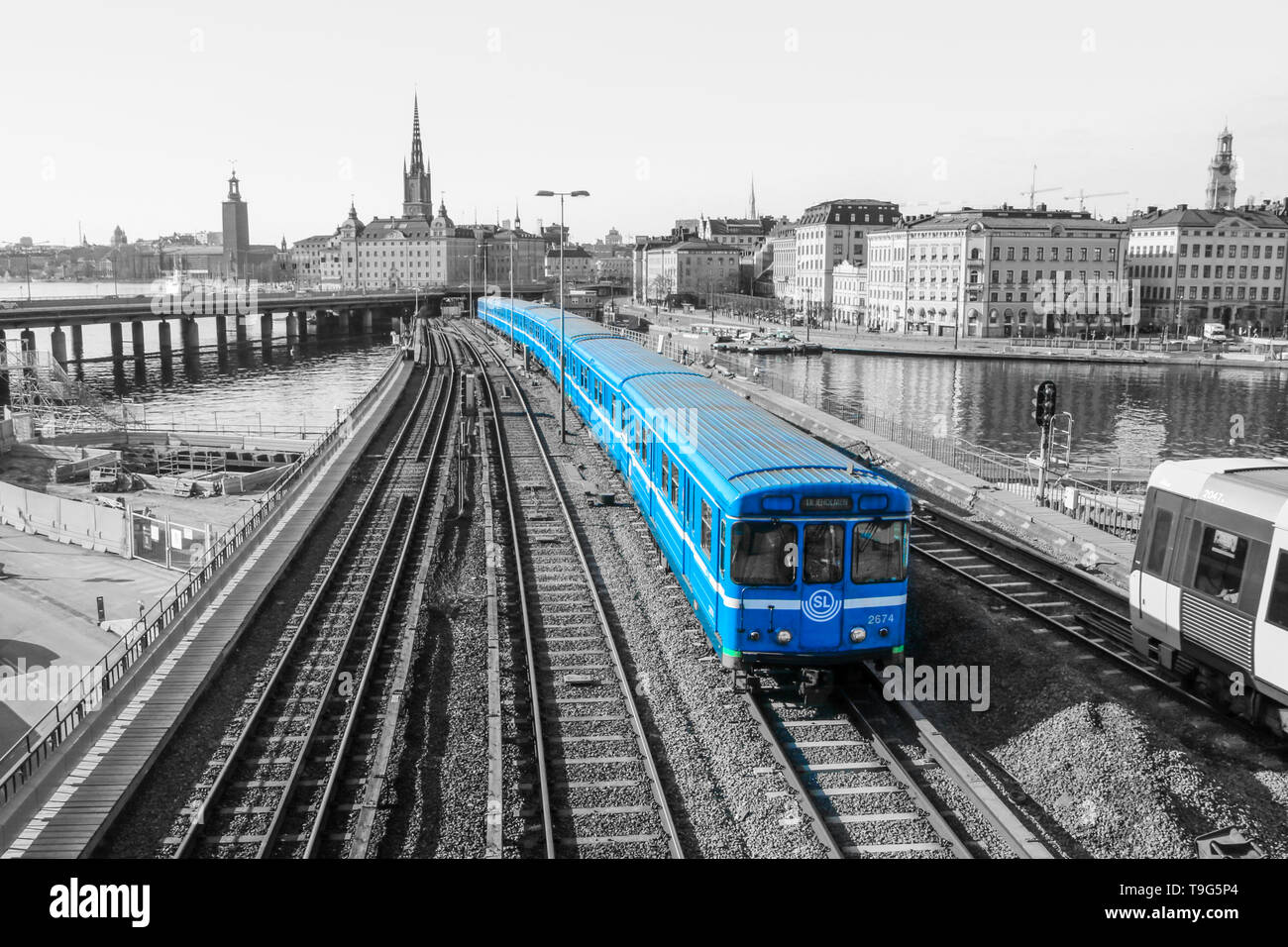 A traditional old swedish metro train in Stockholm is driving on the ...