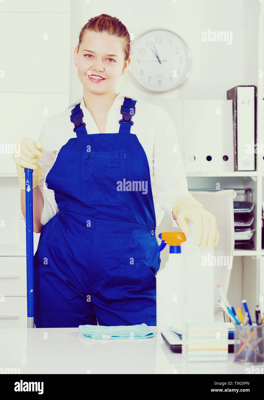 Female office cleaner is satisfied after cleaning in the office Stock ...