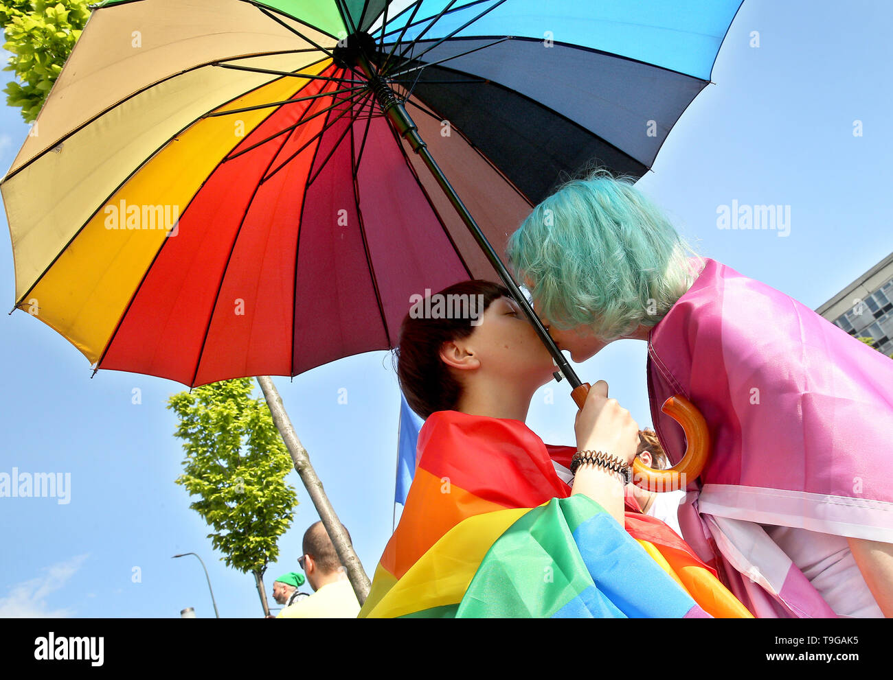 Two women with rainbow umbrella are kissing seen during the Equality ...