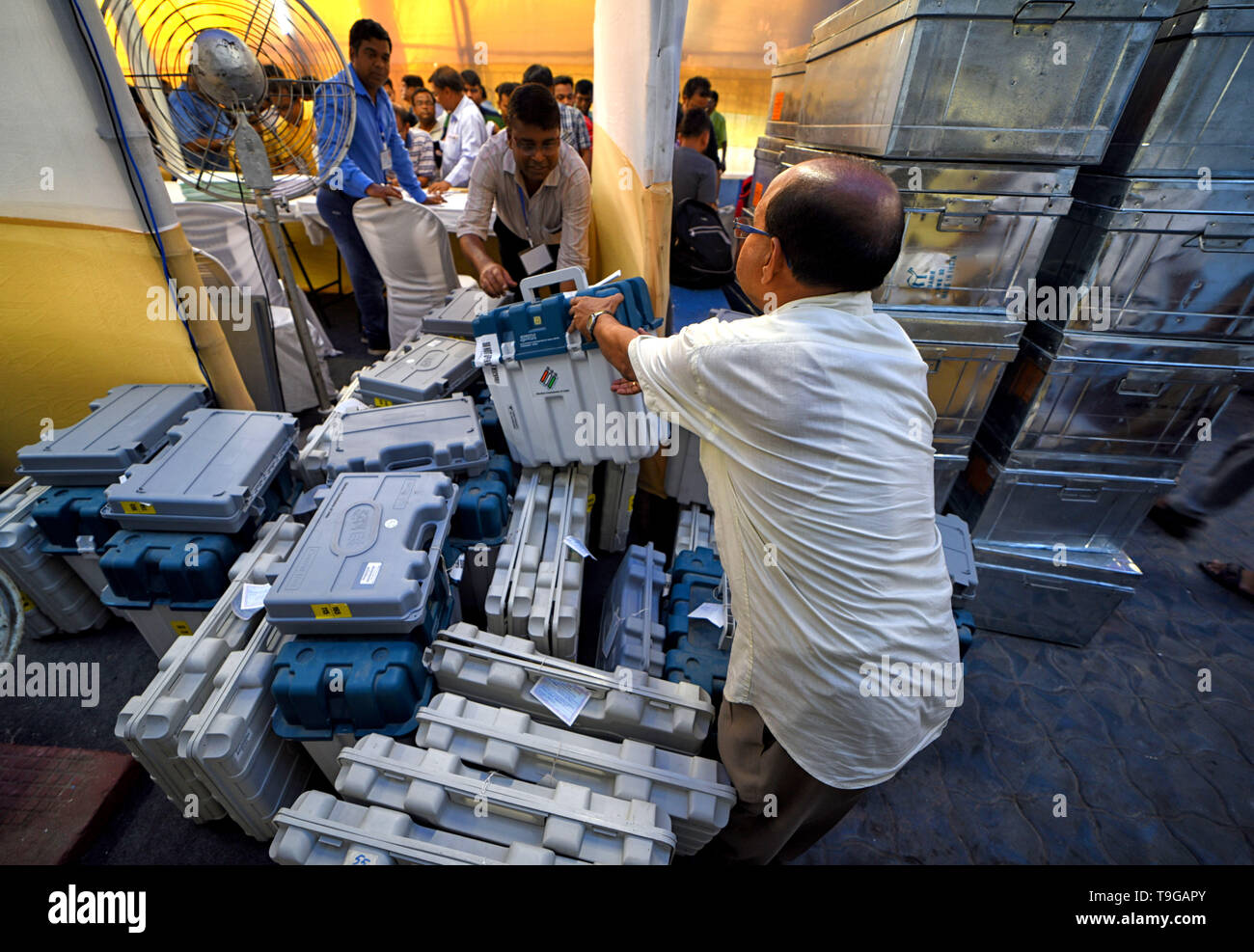 An electoral staff member seen arranging the Electronic Voting Machines ...