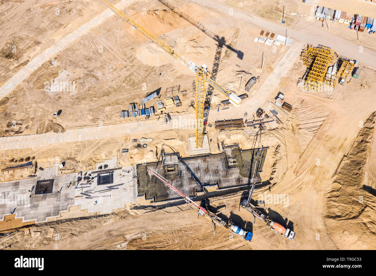 aerial top view of city construction site. concrete foundation works ...