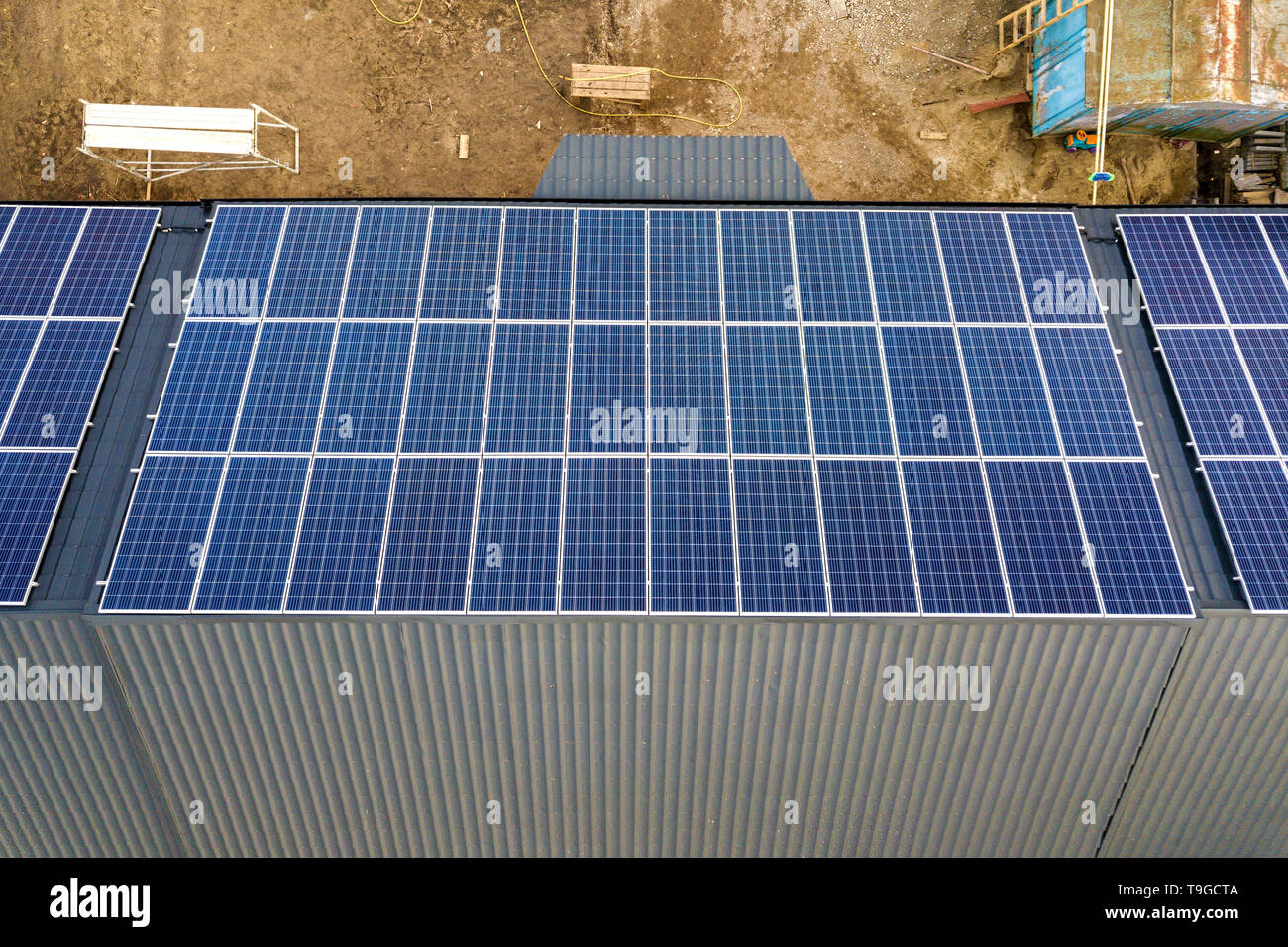Aerial top view of new modern residential house cottage with blue shiny ...