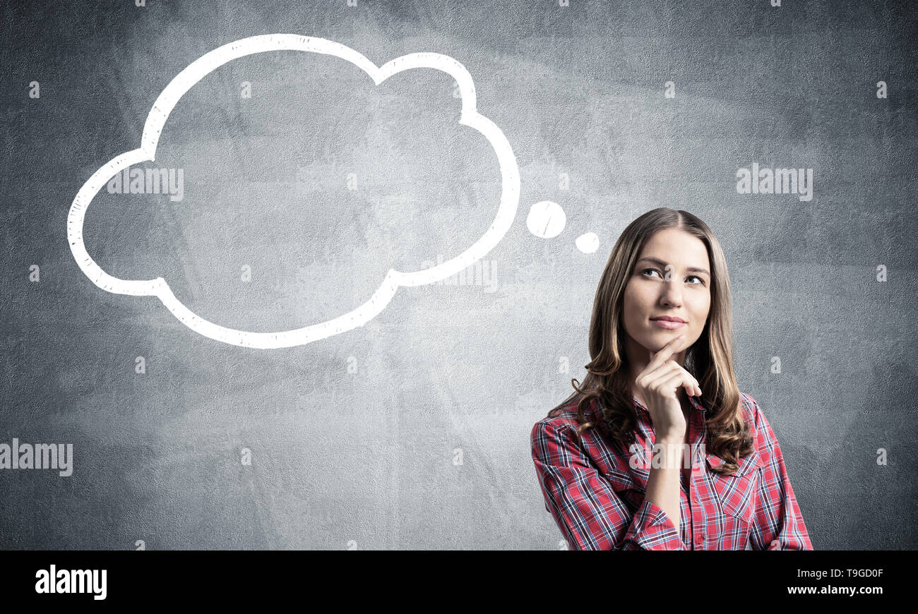 Brown haired woman looks pensively upwards Stock Photo - Alamy