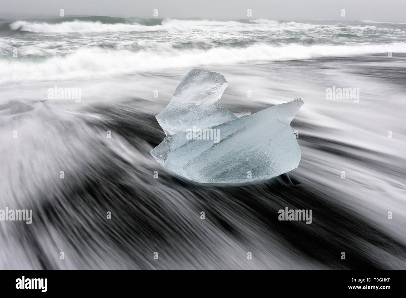 The amazing diamond beach in Iceland. Ice rock with black sand beach at ...