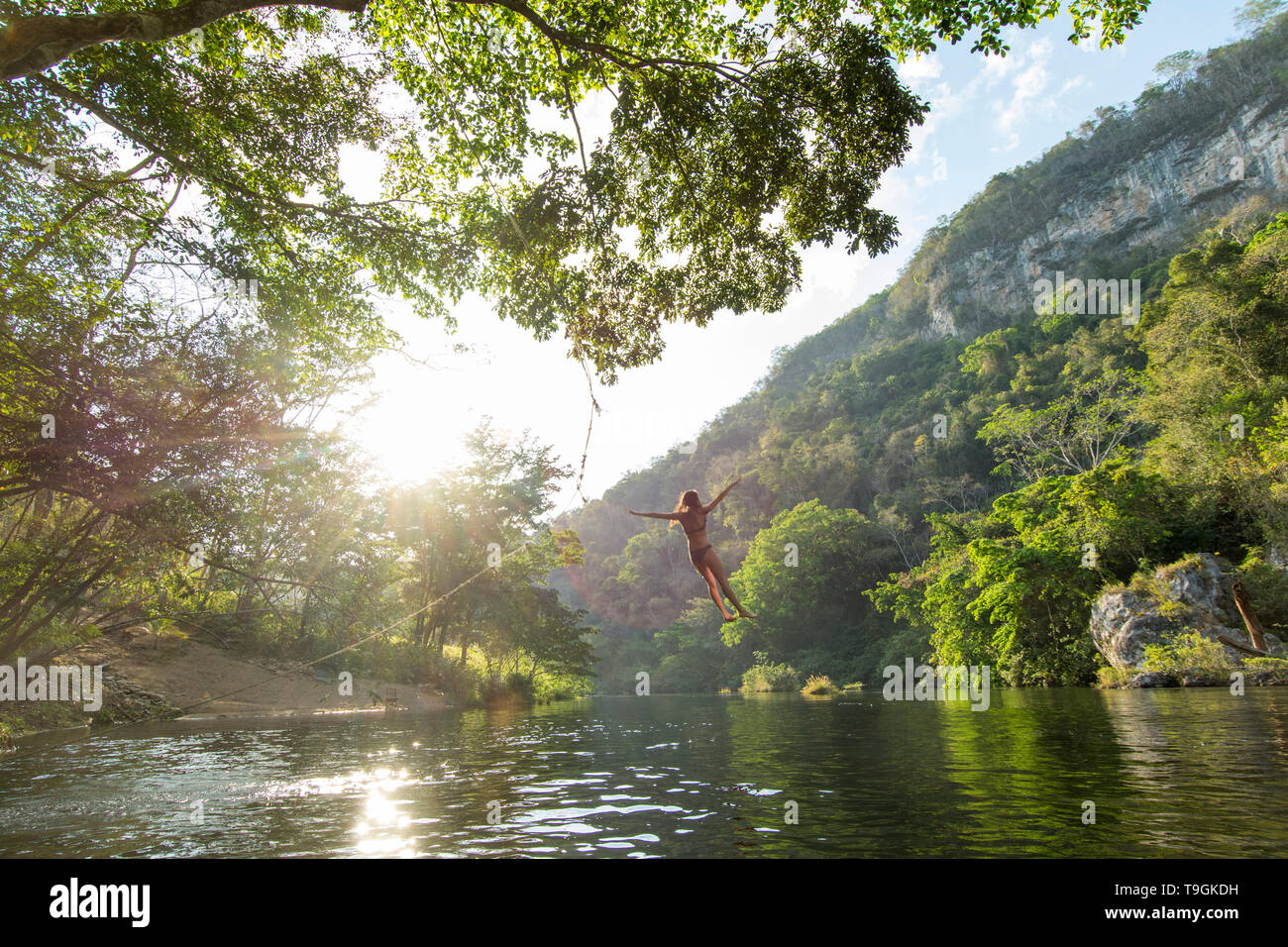Rope swing fun on the Macal River, Black Rock Lodge, San Ignacio, Cayo ...