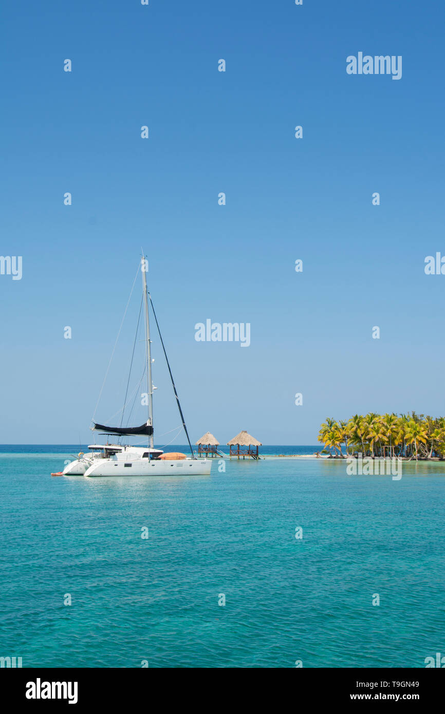 Cruising catamaran at North Long Coco Plum Caye, Belize Stock Photo - Alamy