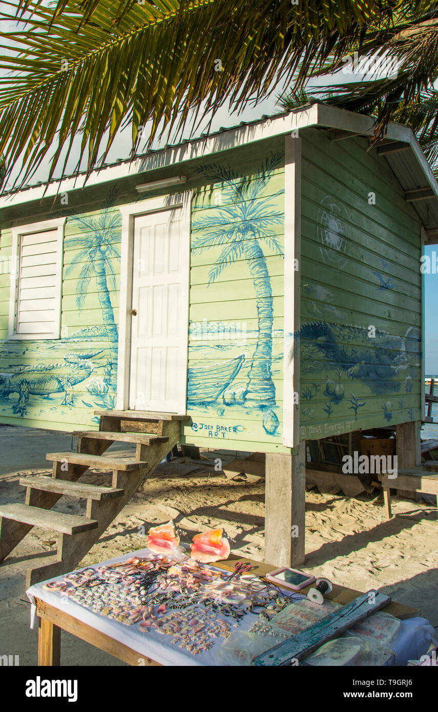 Conch shells and jewelry by tropical theme painted shop, Caye Caulker ...
