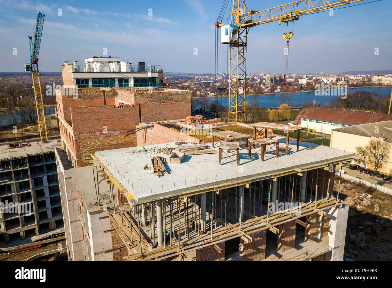 Apartment or office tall building under construction, top view. Brick ...