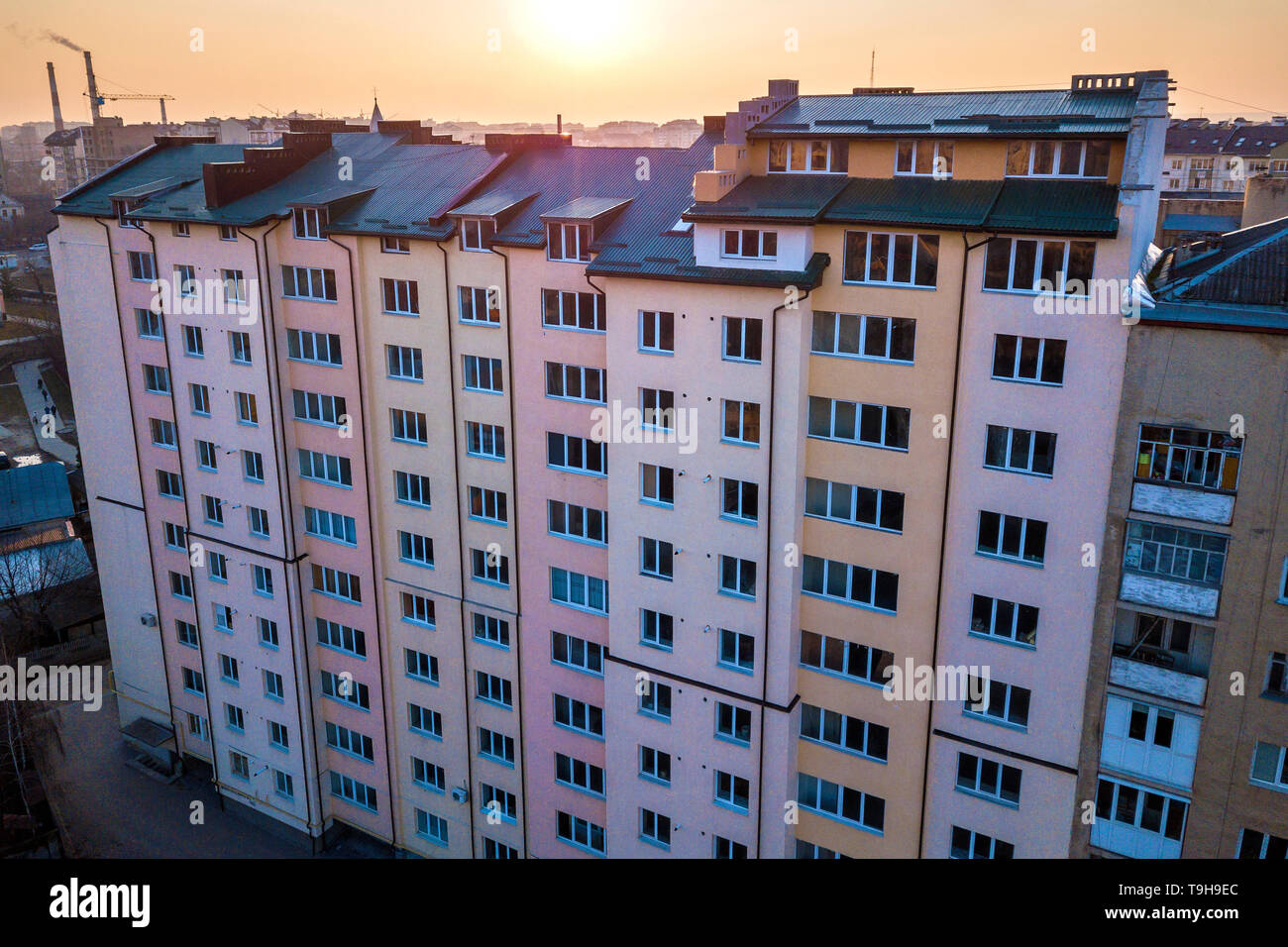 Aerial view of attic annex room exterior with plastic windows, roof and ...