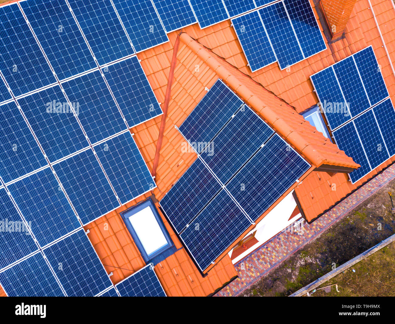 Aerial top view of new modern residential house cottage with blue shiny ...