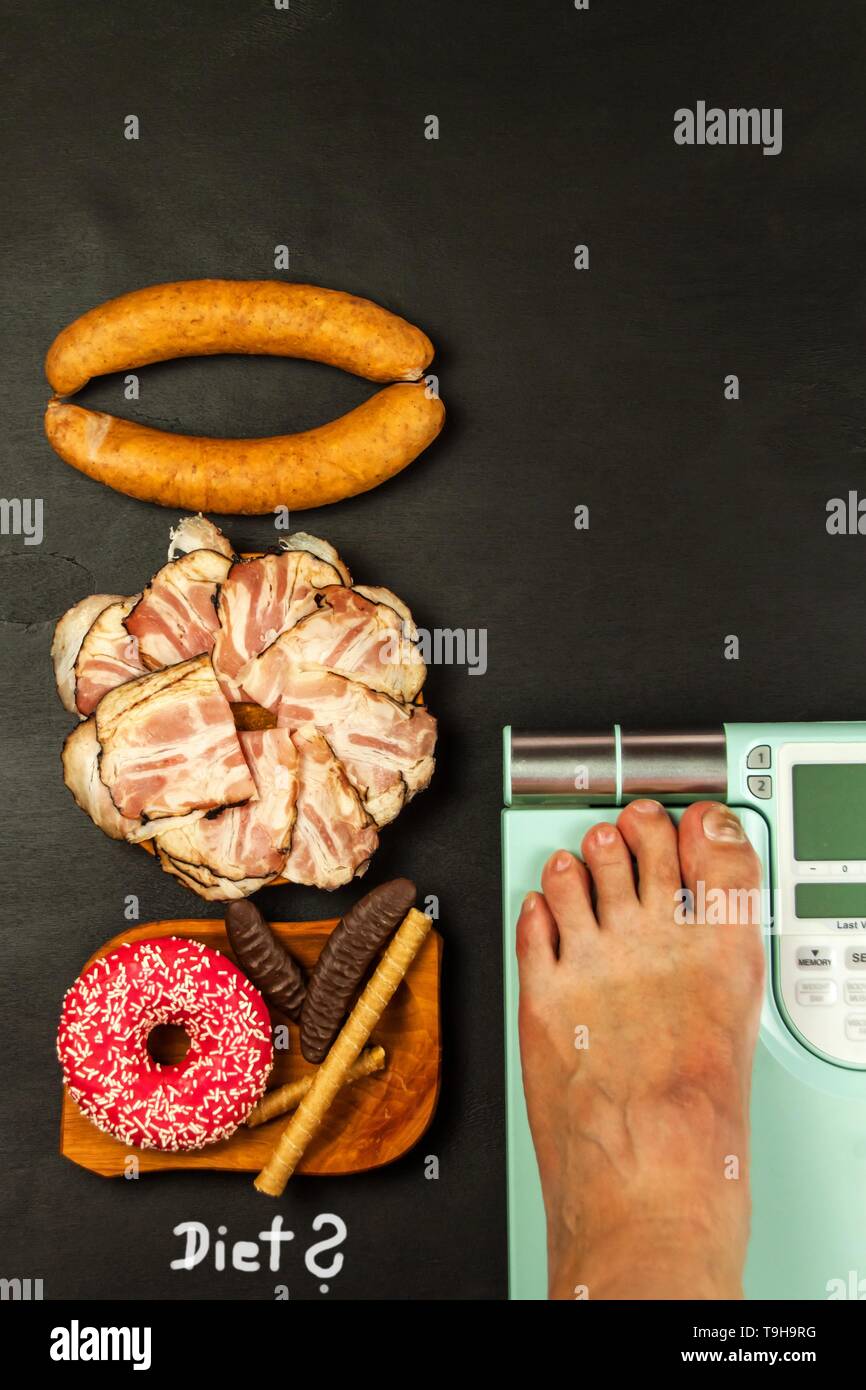 Healthy and unhealthy food. Obesity concept. Modern digital weight and ...