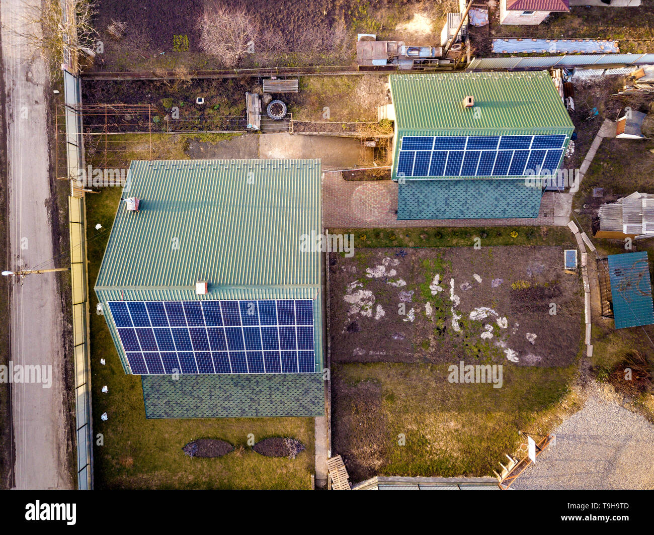 Aerial top view of new modern residential house cottage with blue shiny ...