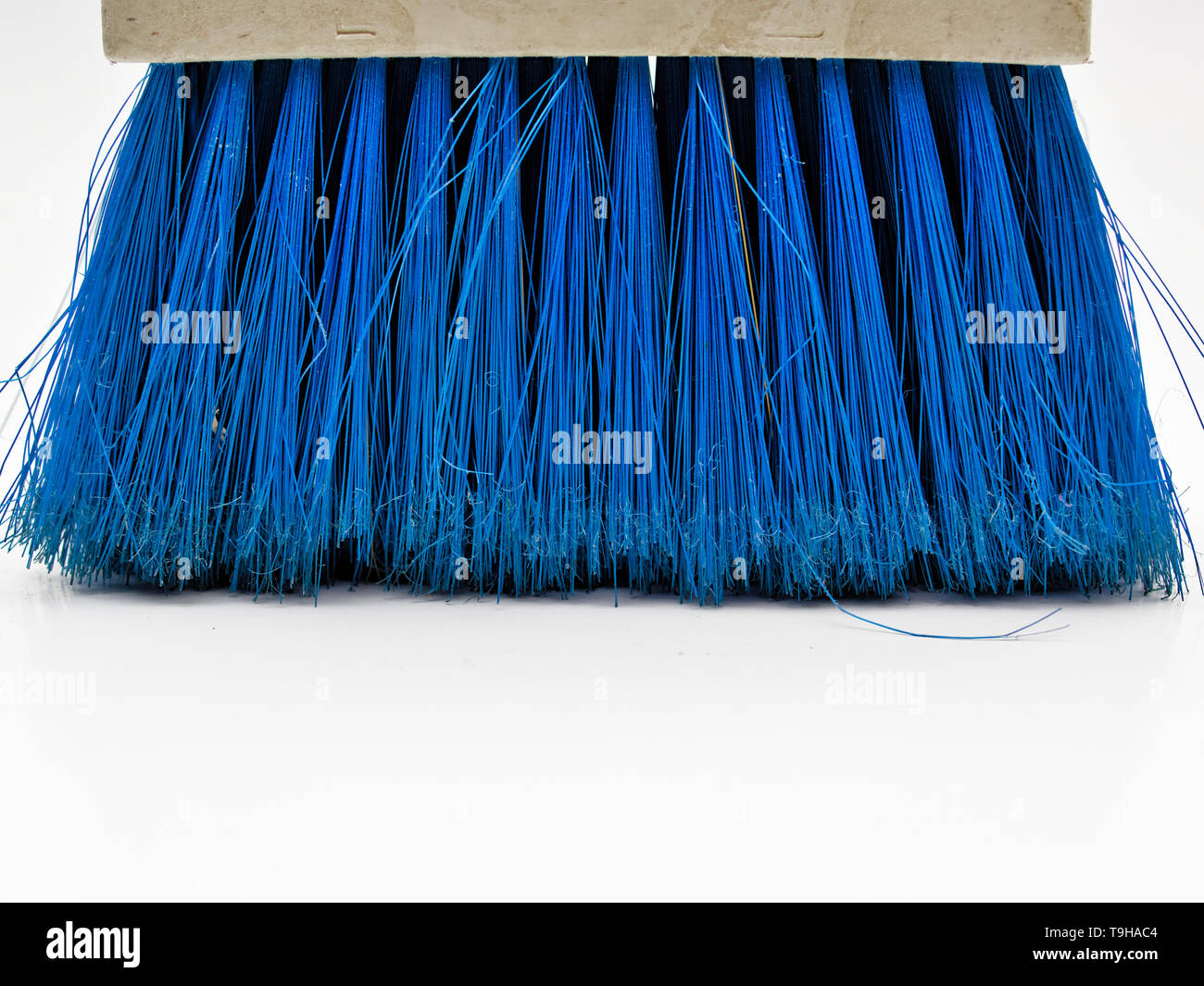 Mini blue dust sweeper isolated on white background Stock Photo - Alamy