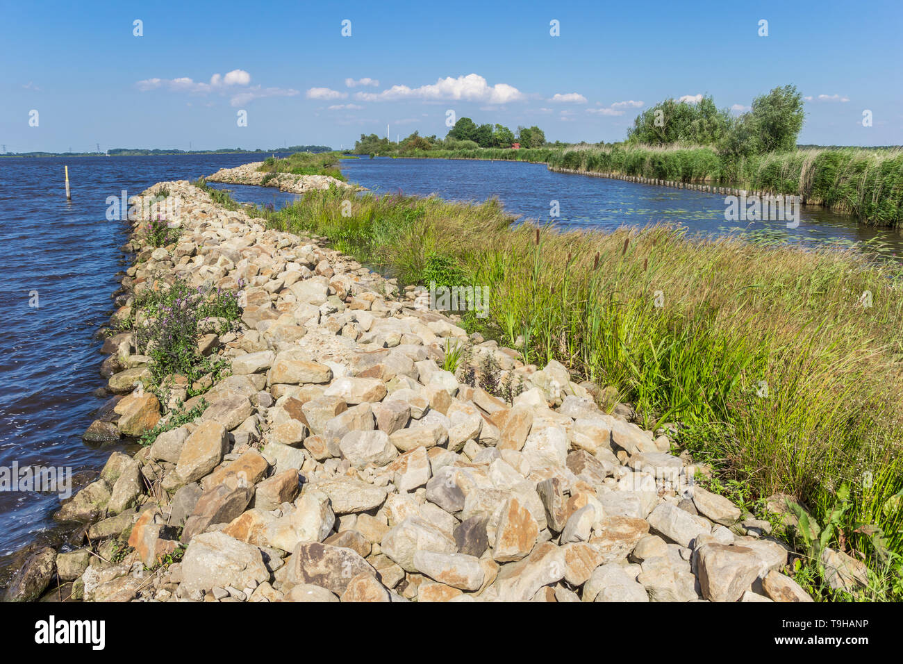 Small dike at the Schildmeer lake in Groningen, Holland Stock Photo - Alamy