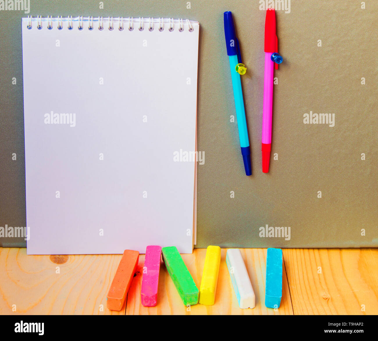back to school concept, a pen, Notepad chalk Stock Photo - Alamy