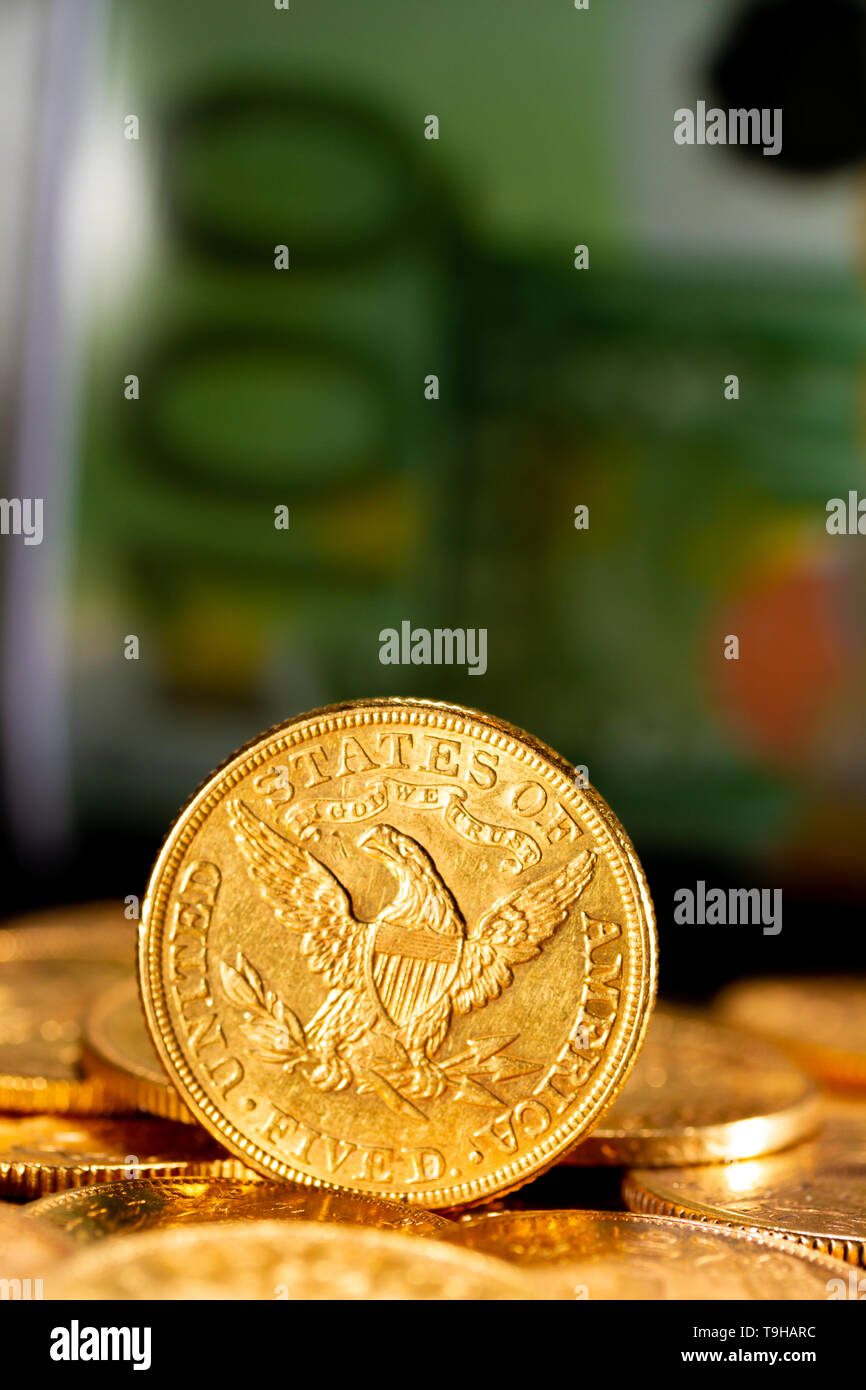 Real Gold coins over dark background Stock Photo - Alamy