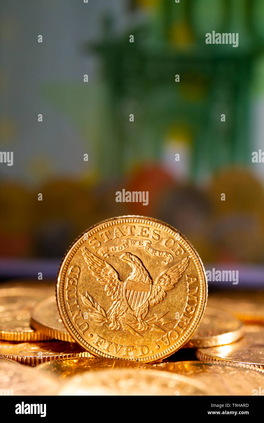 Real Gold coins over dark background Stock Photo - Alamy